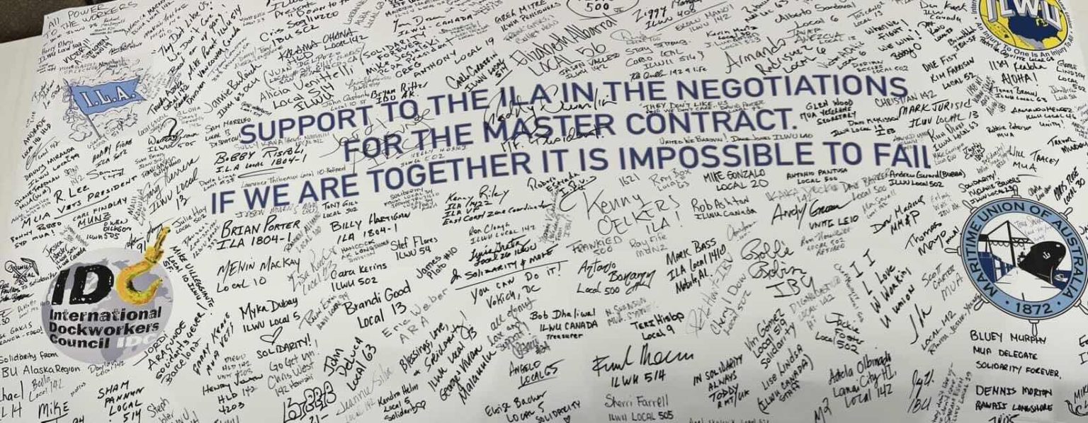 DOCKWORKER UNIONS FROM ALL AROUND THE WORLD SIGN BANNER TO SHOW SUPPORT ...